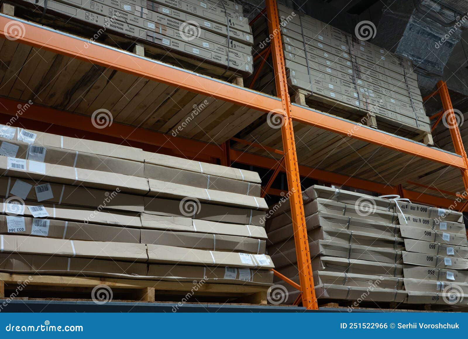 A Large Yellow Rack with Many Cardboard Boxes Stock Photo - Image of ...