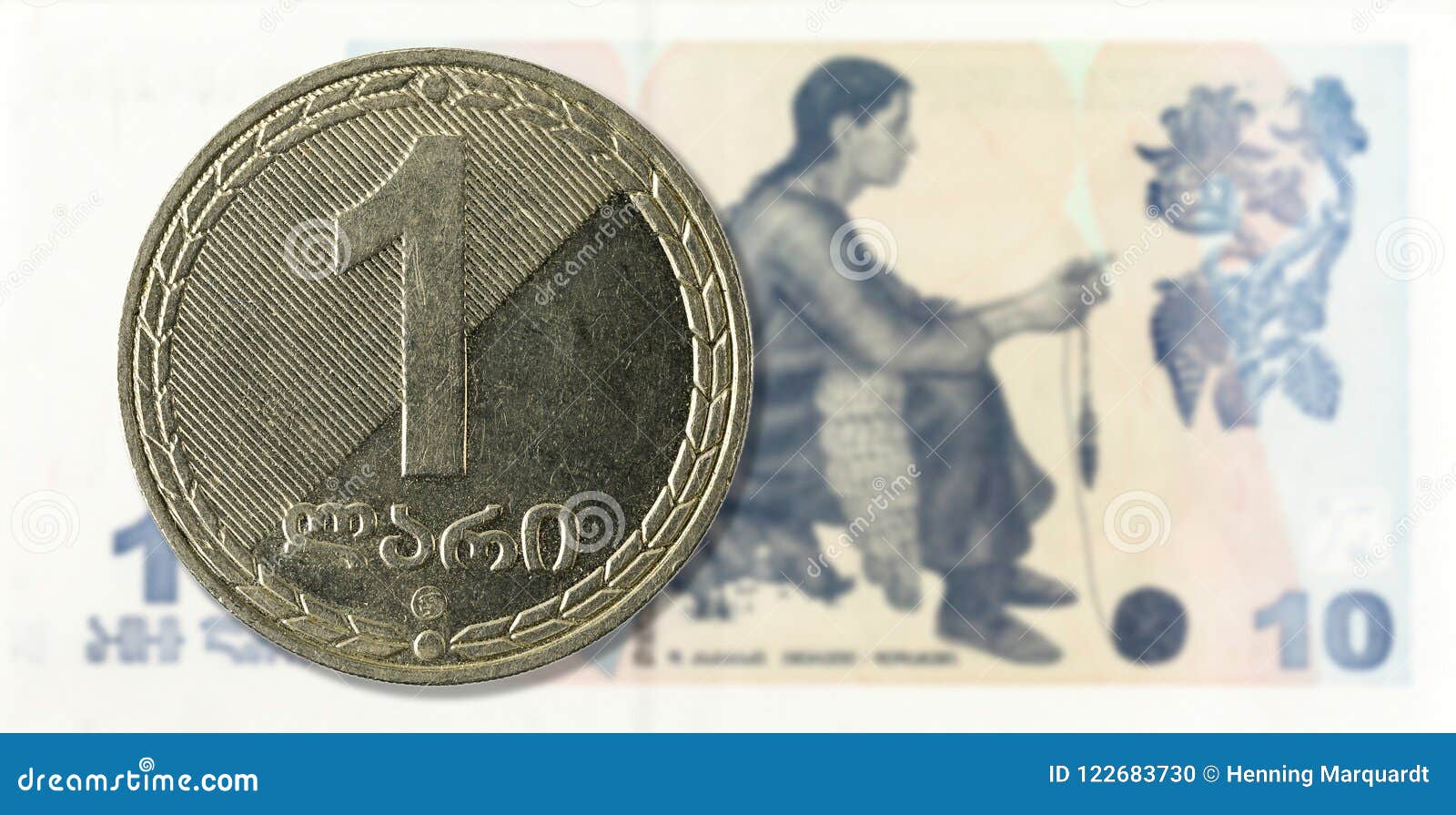 1 Lari Coin Against 10 Georgian Lari Bank Note Stock Photo - Image of ...