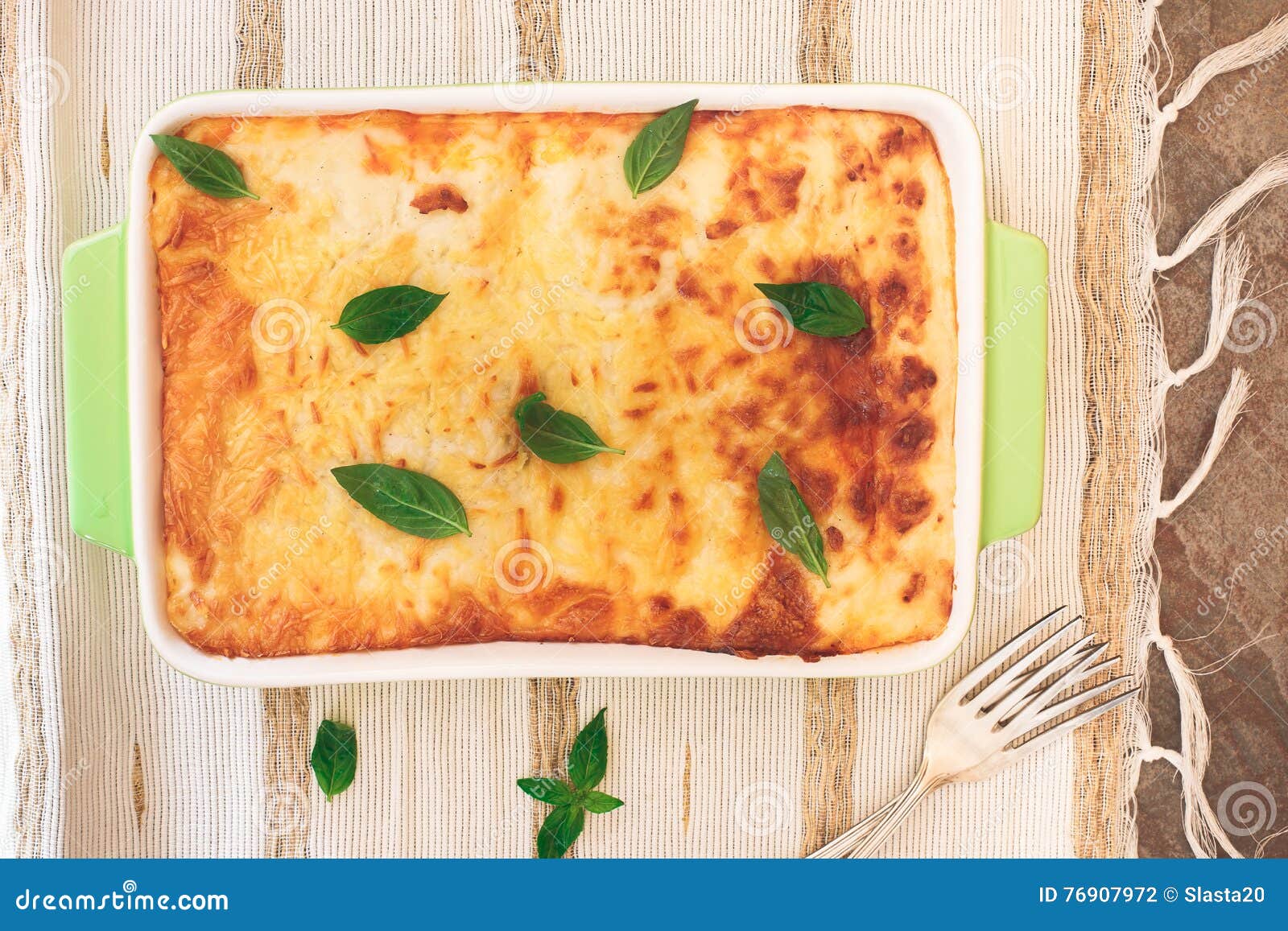 Lasagna in a baking dish stock photo. Image of cheese - 76907972