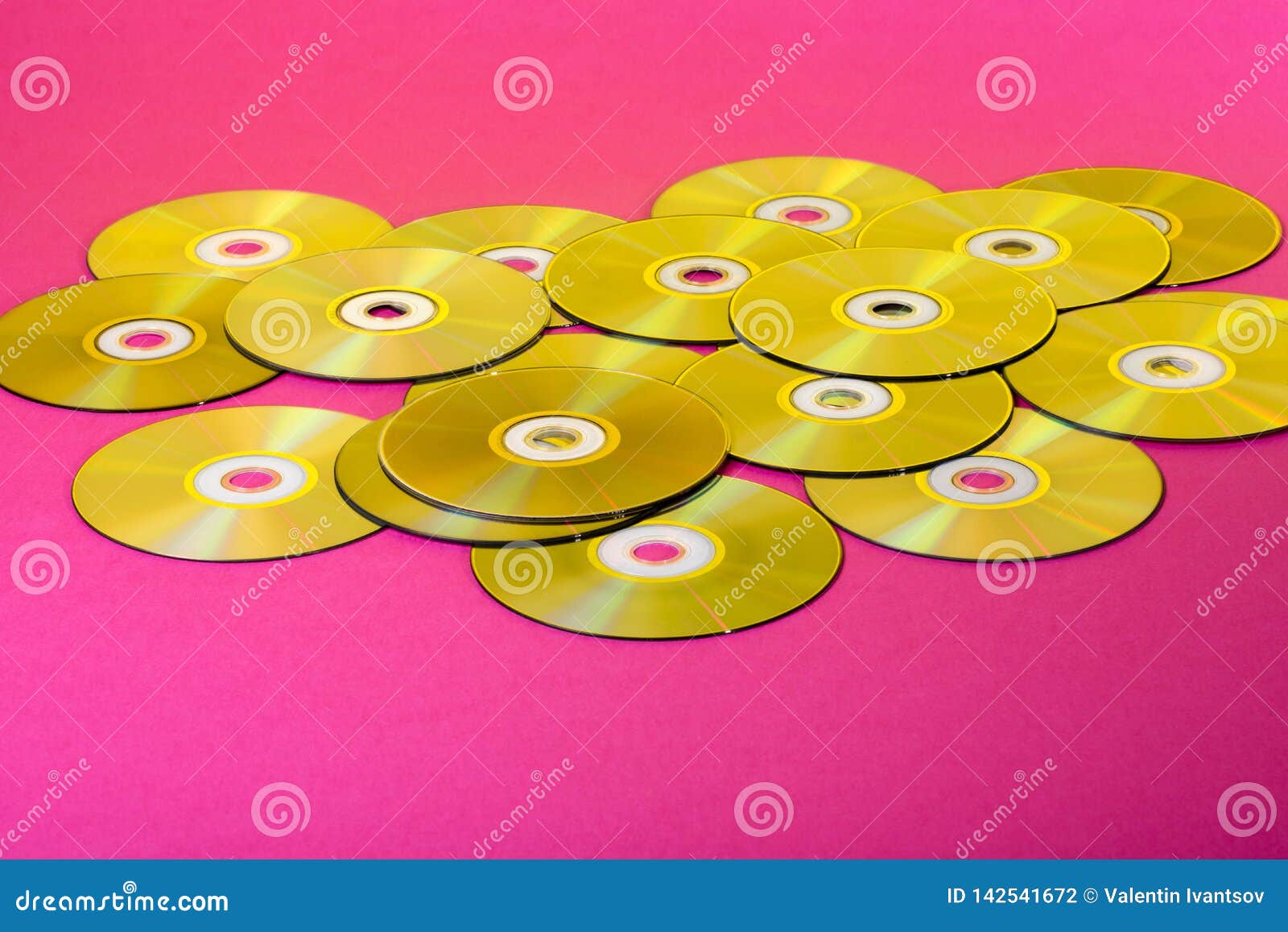 Laser Compact Discs on a Pink Background with Color Reflection Stock ...