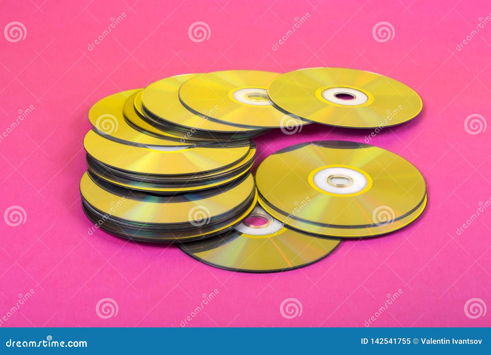 Laser Compact Discs on a Pink Background with Color Reflection Stock ...