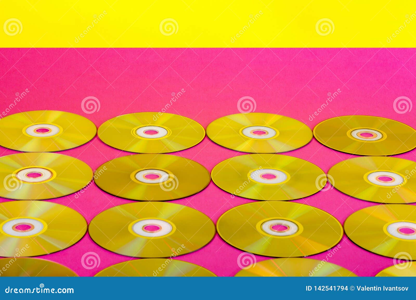 Laser Compact Discs on a Pink Background with Color Reflection Stock ...