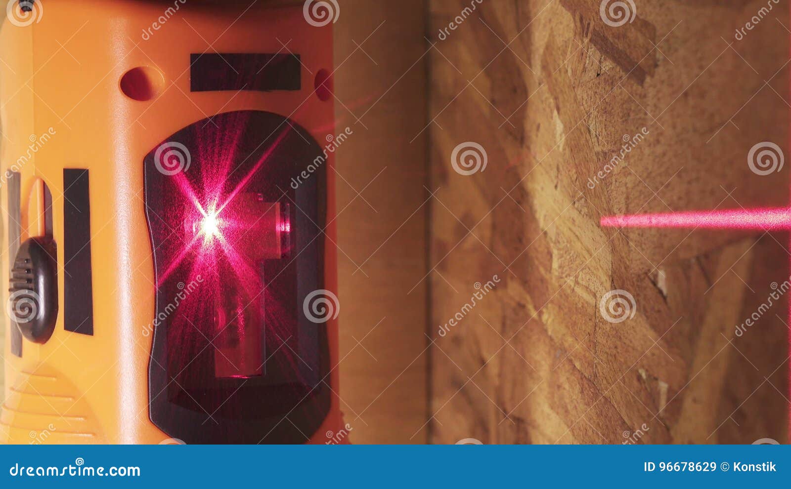 Laser Construction Level in Work and a Marking His Beams on a Wall ...