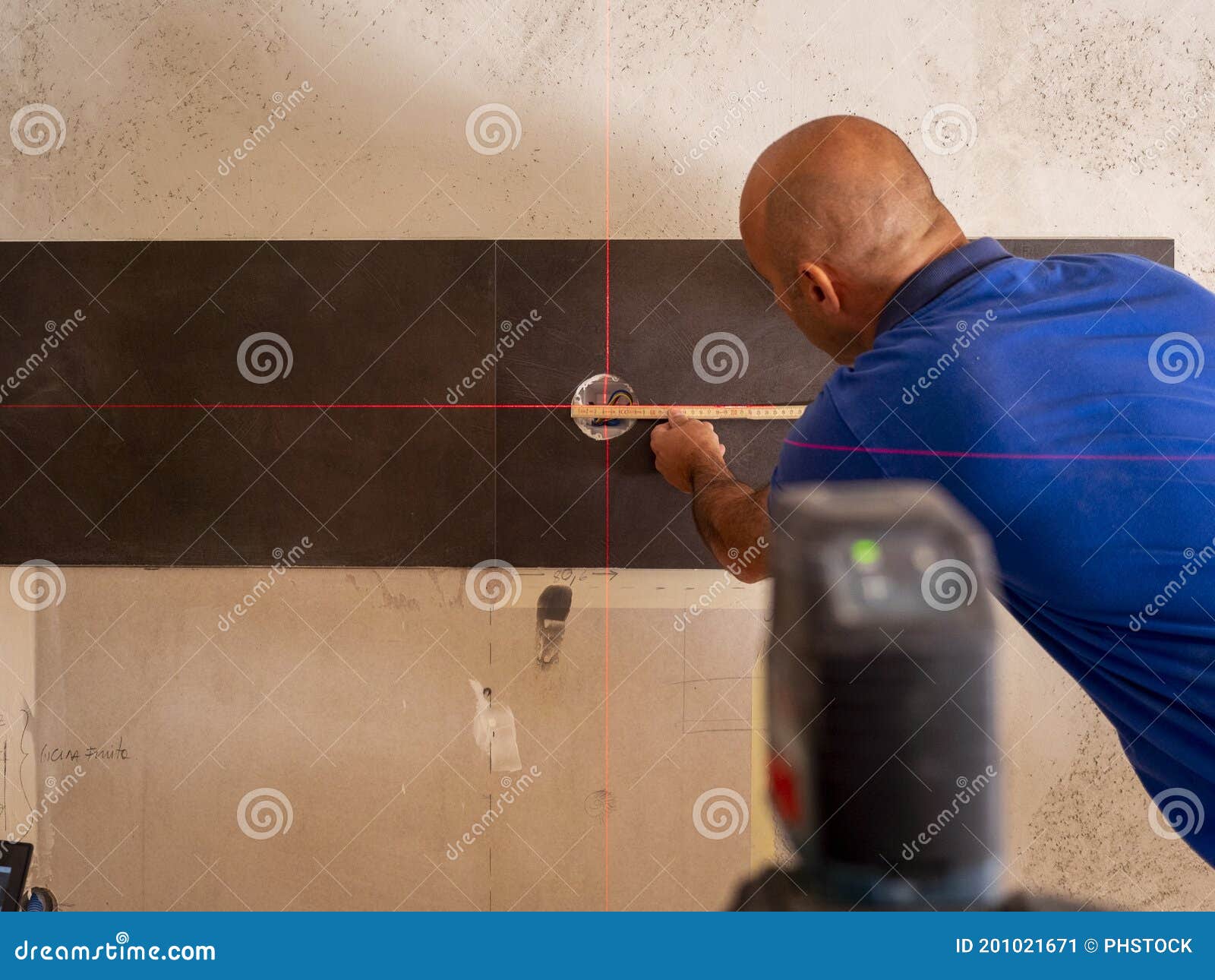 Laser level on the wall stock image. Image of instrument - 201021671