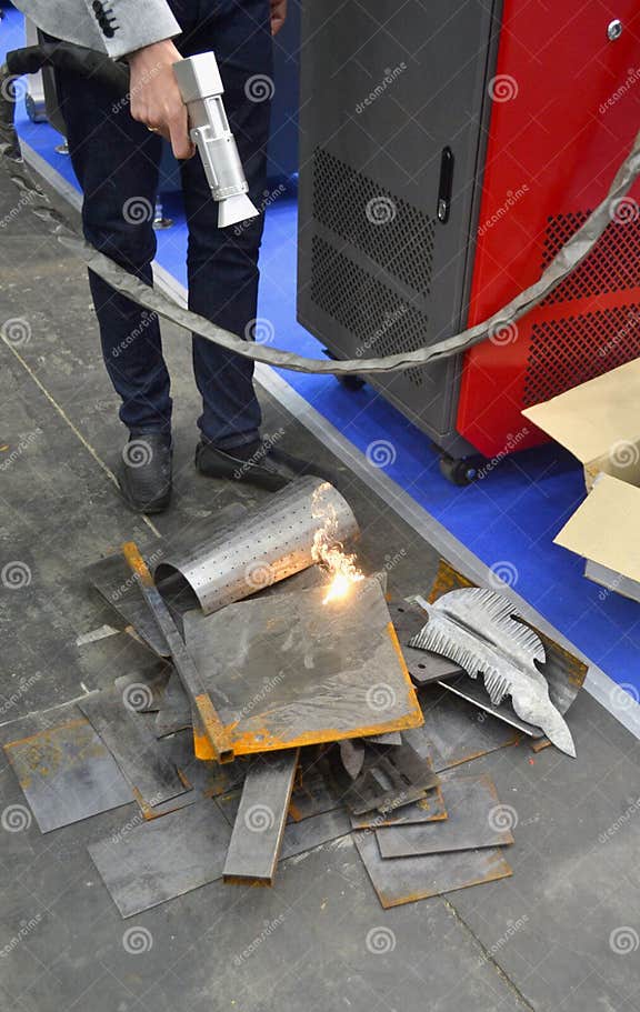 Laser Metal Cleaning. Man Using Laser Metal Cleaning Machine Clean ...