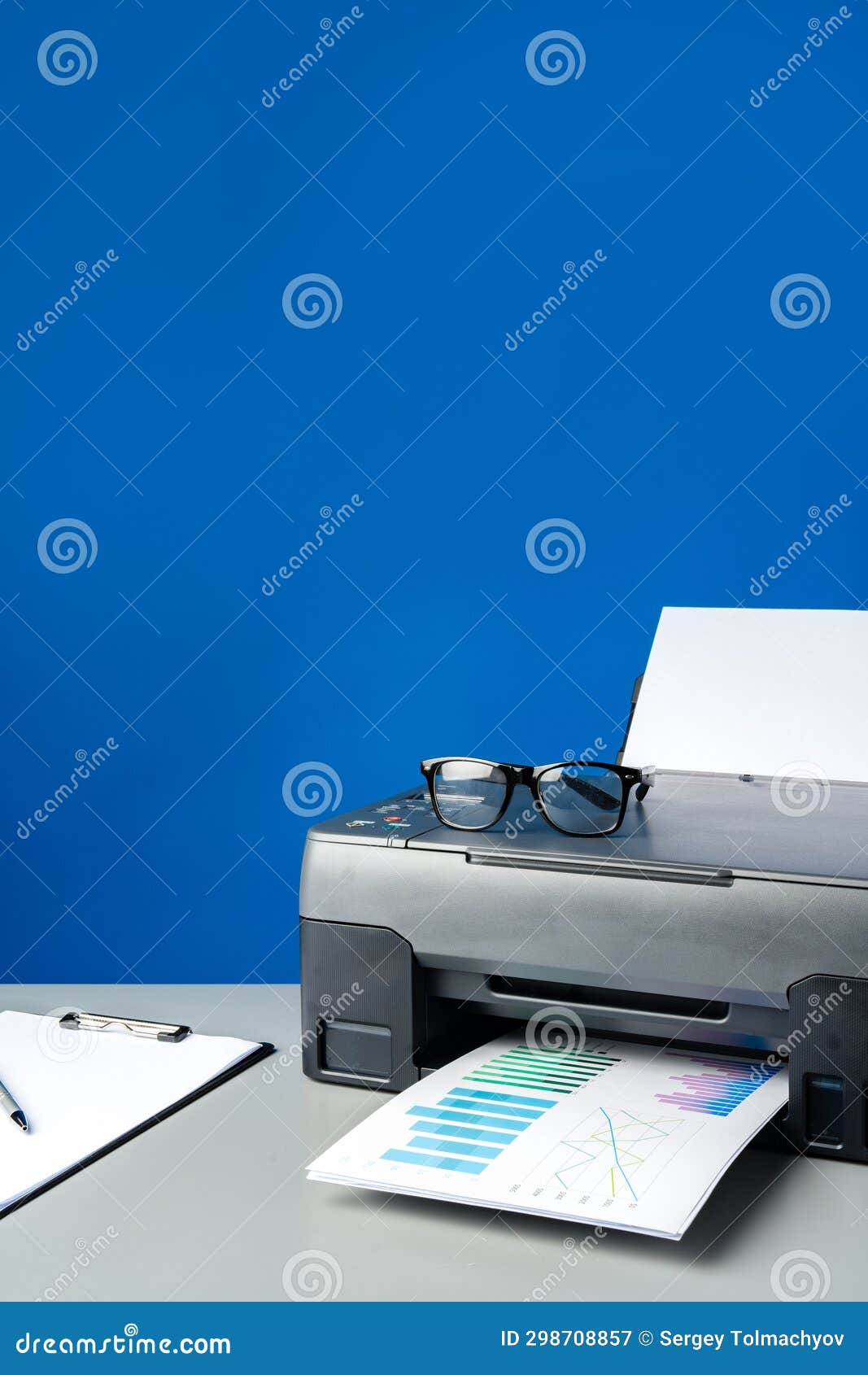 Laser Printer on Desk Against Blue Background. Stock Image - Image of ...