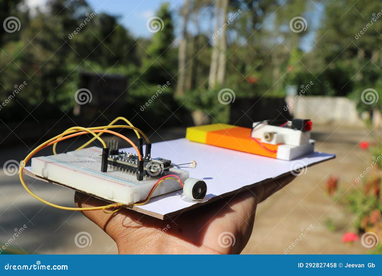 Breadboard With A Microcontroller Board, Electric Resistors And Led ...