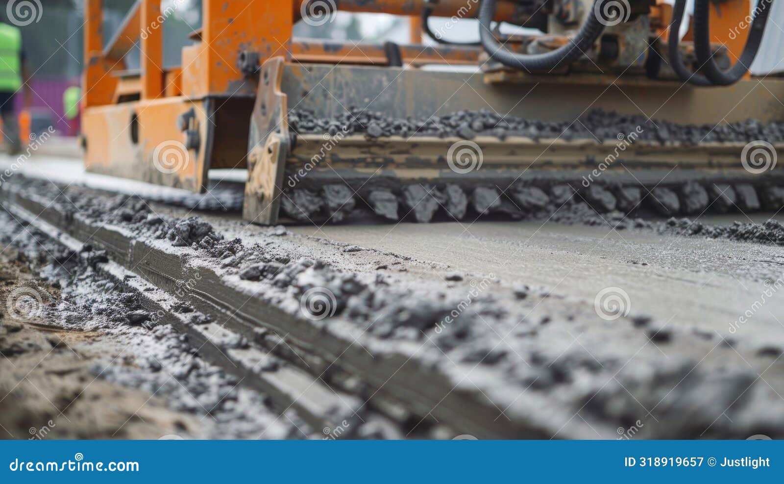 A Laserguided Concrete Paver Smoothly Glides Across the Ground Laying ...