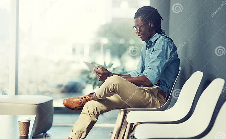 The Last Candidate Left for the Interview. a Young Businessman Using a ...