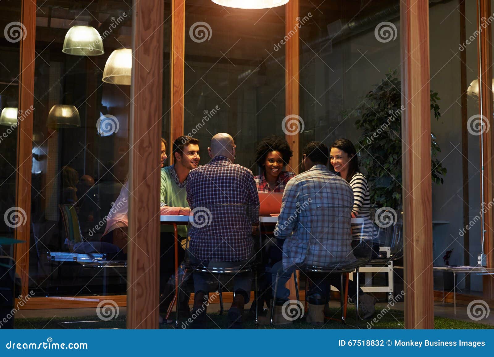 Late Night Meeting Around Table in Design Office Stock Photo - Image of ...
