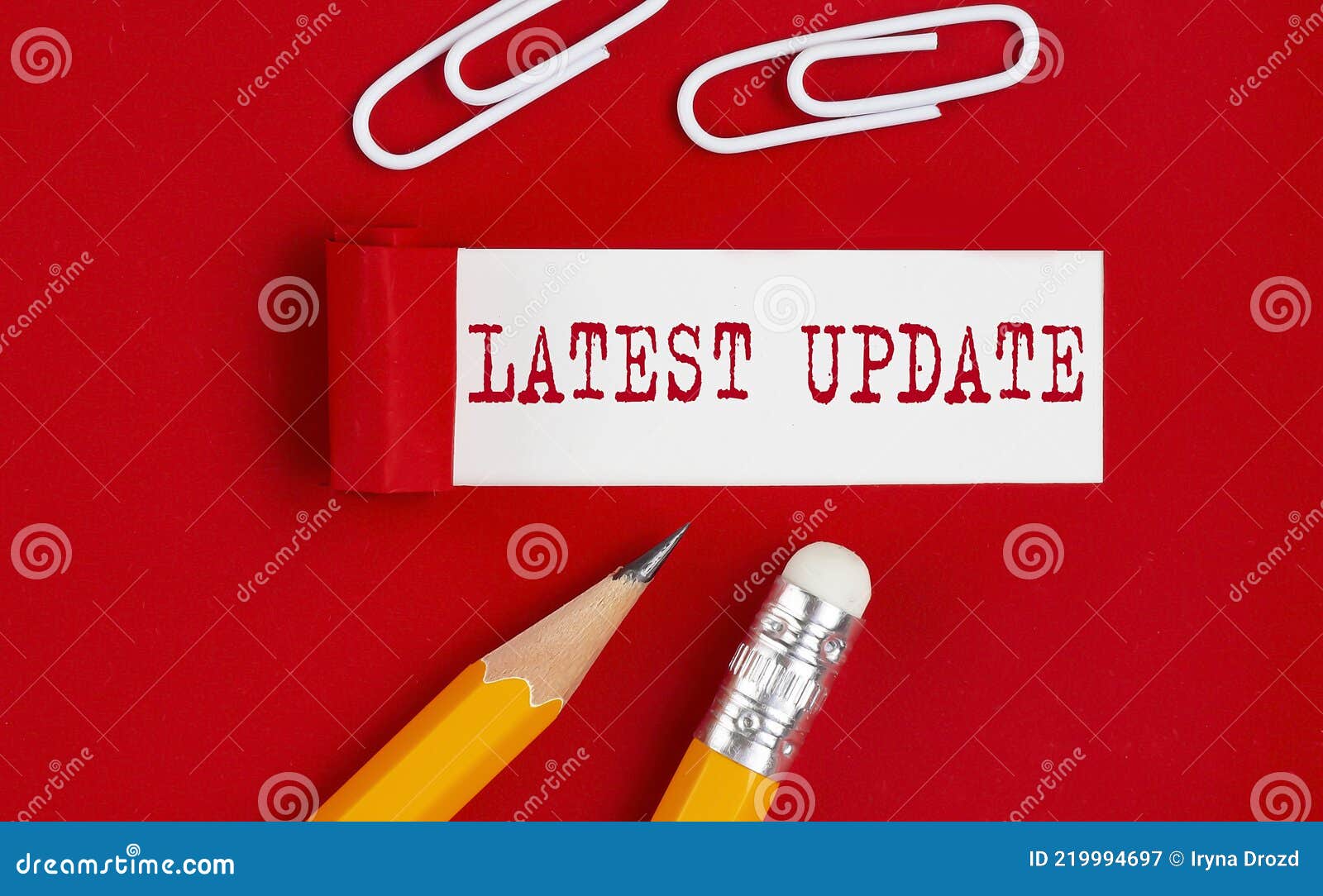 LATEST UPDATE Message Written Under Torn Red Paper with Pencils and ...