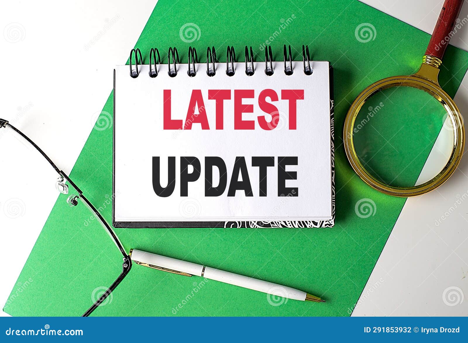 LATEST UPDATE Text on Notebook on Green Paper Stock Photo - Image of ...