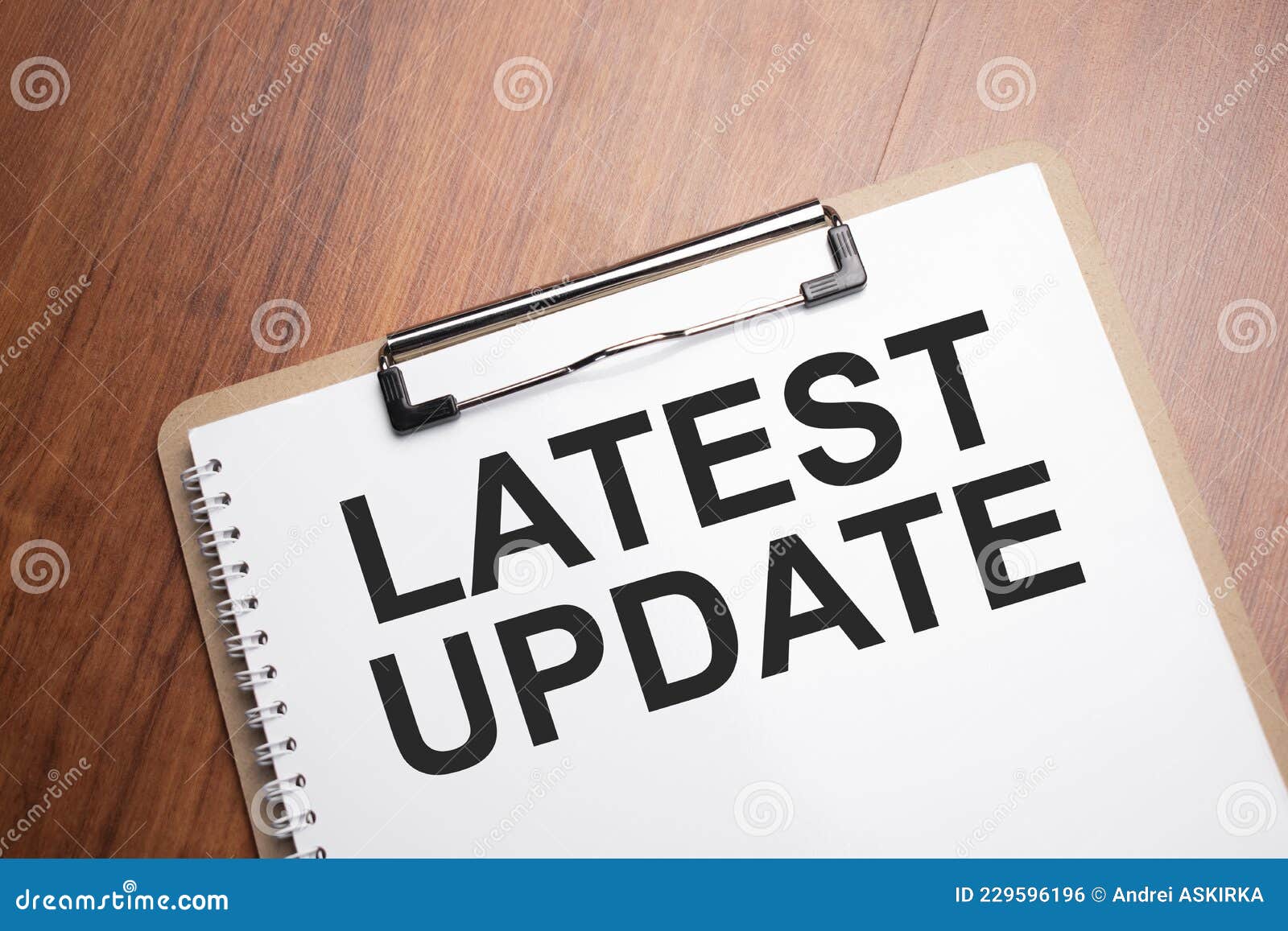 Latest Update Text on White Paper on the Wood Table Stock Photo - Image ...
