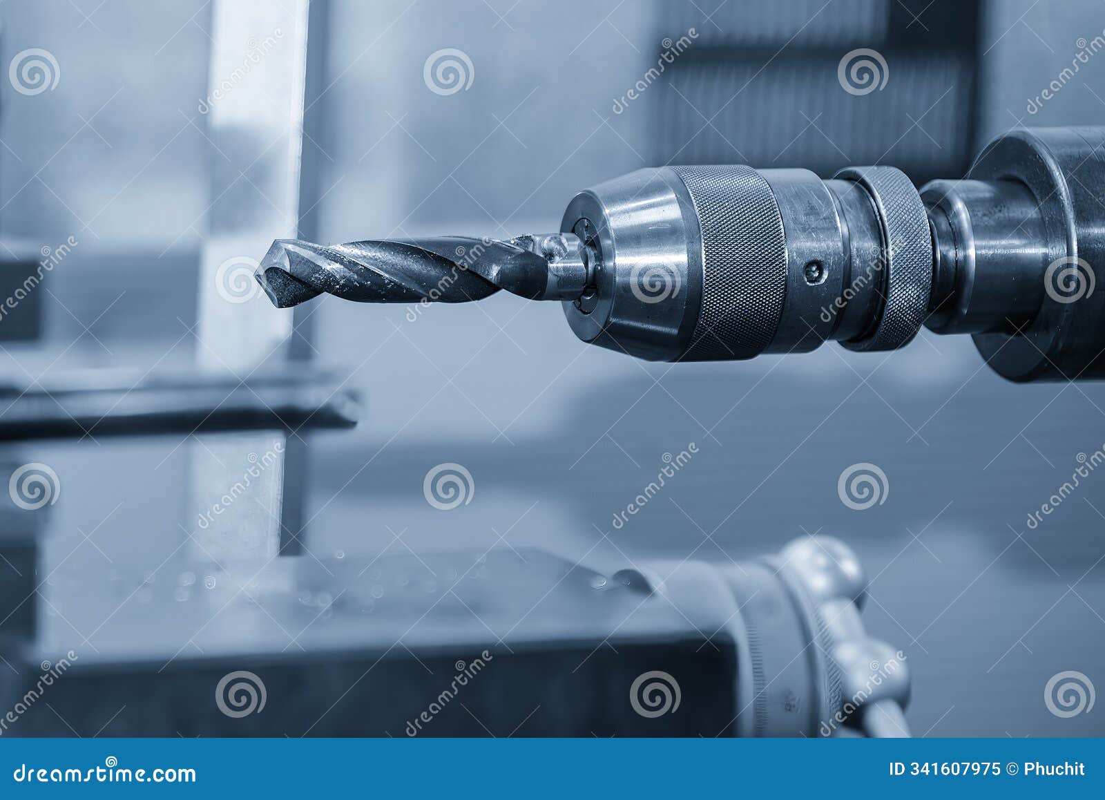 The Lathe Machine Drilling Process the Metal Parts in the Light Blue ...