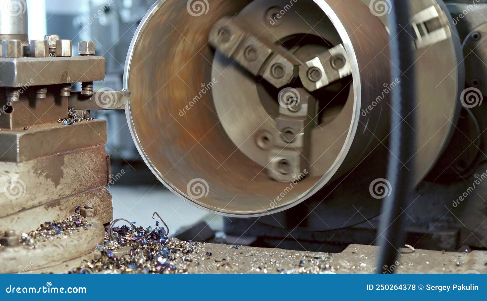 Lathe Processes Metal in Workshop and Chips Fly. Close-up of Workflow ...