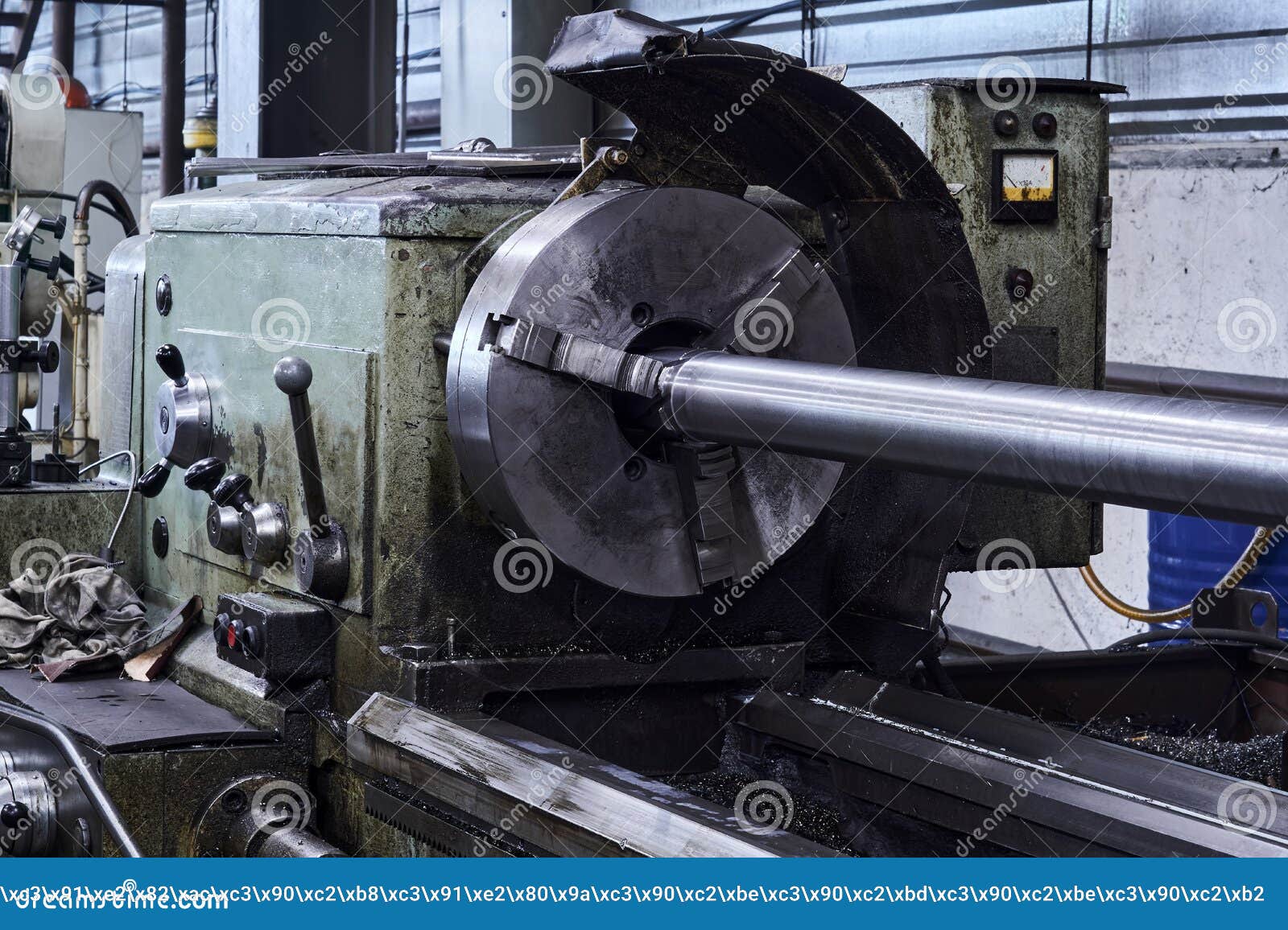 Lathe with a Workpiece Fixed in the Spindle Faceplate in the Workshop ...