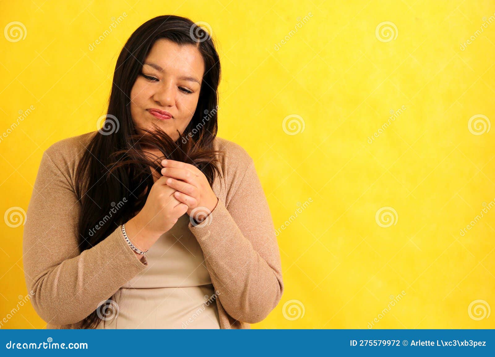 Latin Adult Woman With Very Long Straight Hair Suffers And Is Sad Because Her Hair Is A Mess And