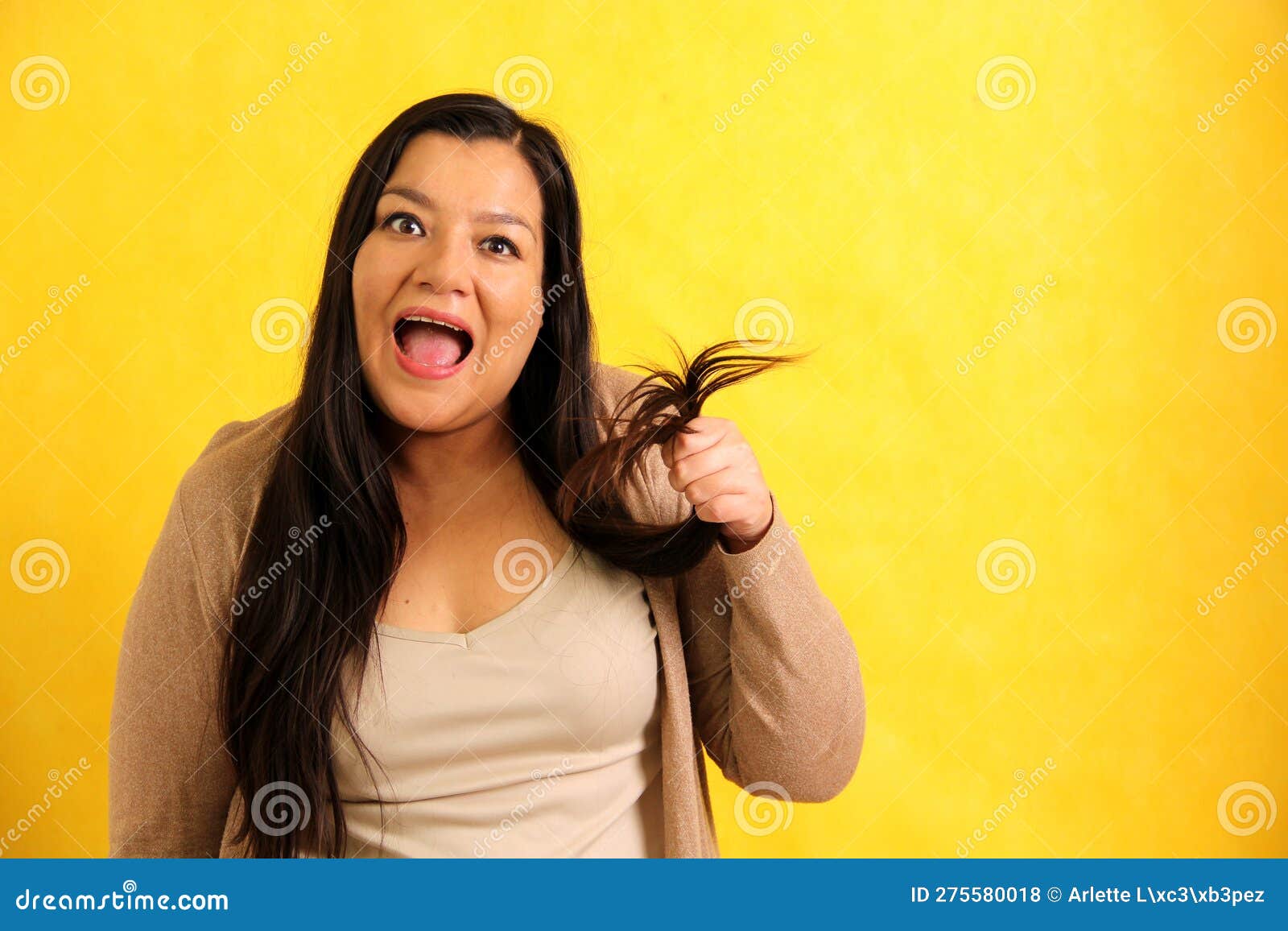 Latin Adult Woman With Very Long Straight Hair Suffers And Is Sad Because Her Hair Is A Mess And