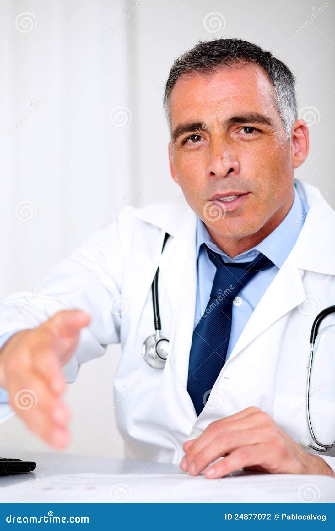 Latin Doctor Greeting at the Consultation Desk Stock Photo - Image of ...