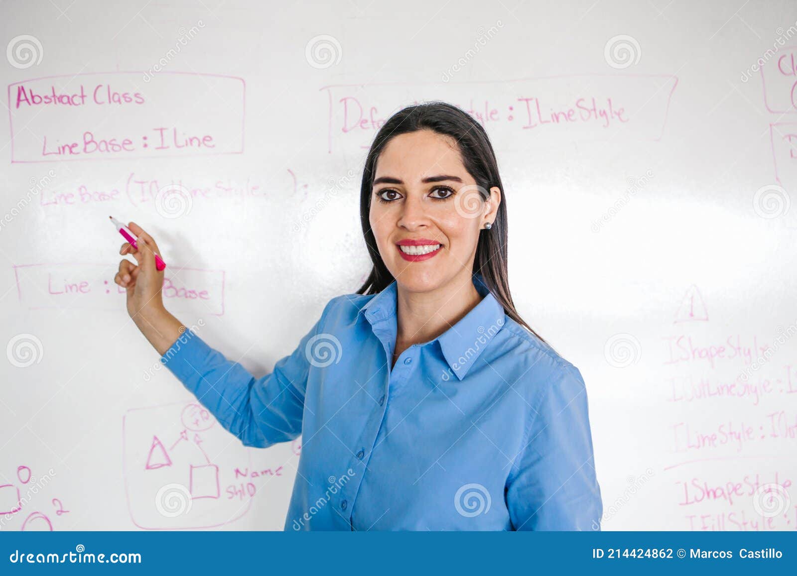 Latin Female School Teacher Looks at Camera in Classroom Speaking ...