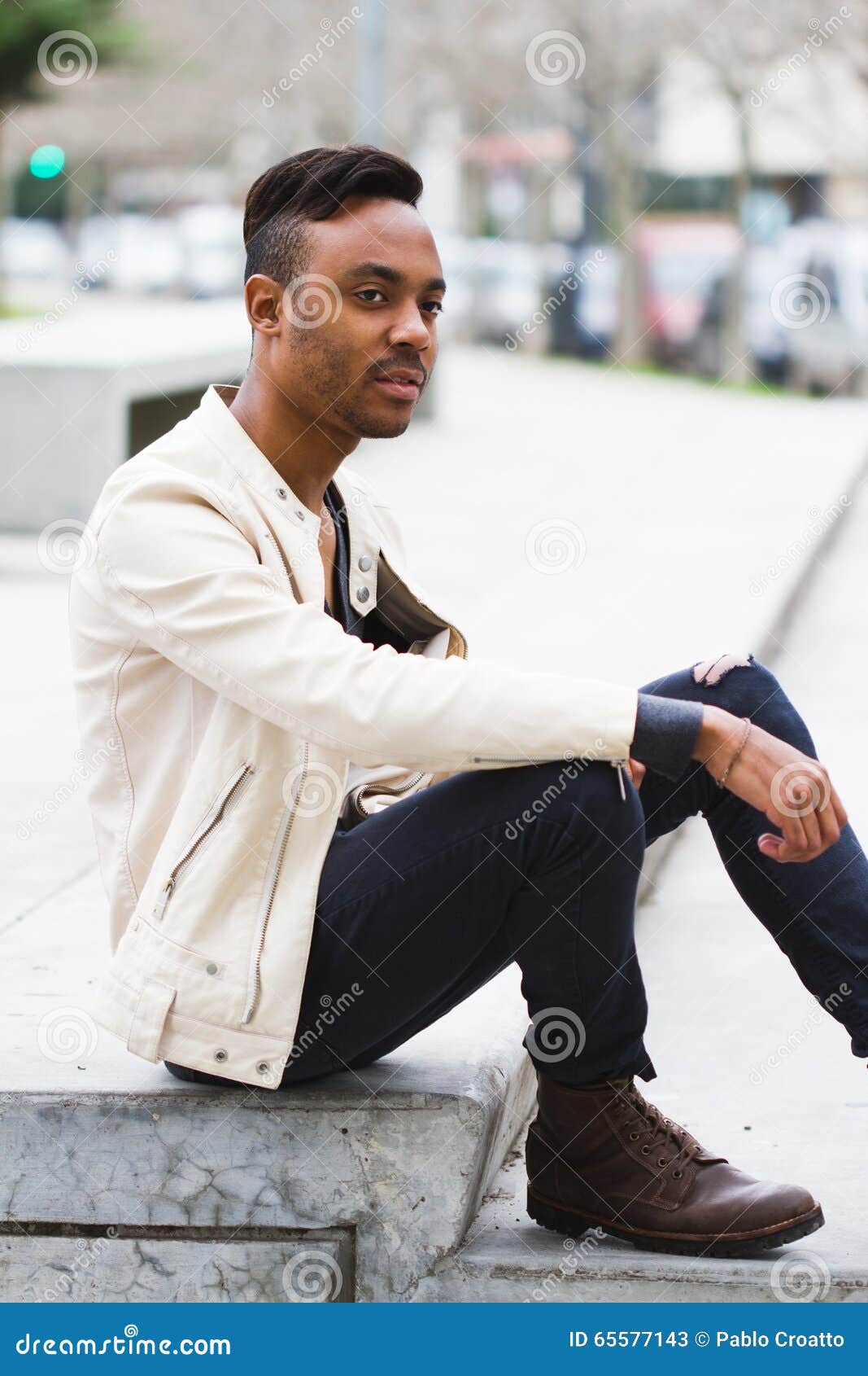 Latin man posing outdoors stock image. Image of city - 65577143