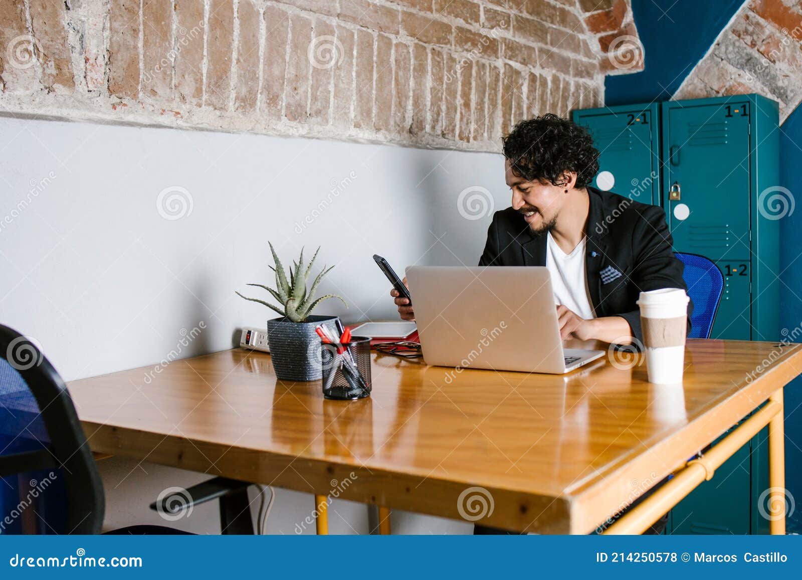 Latin Man Working with Computer at Office in Mexico City Stock Photo ...