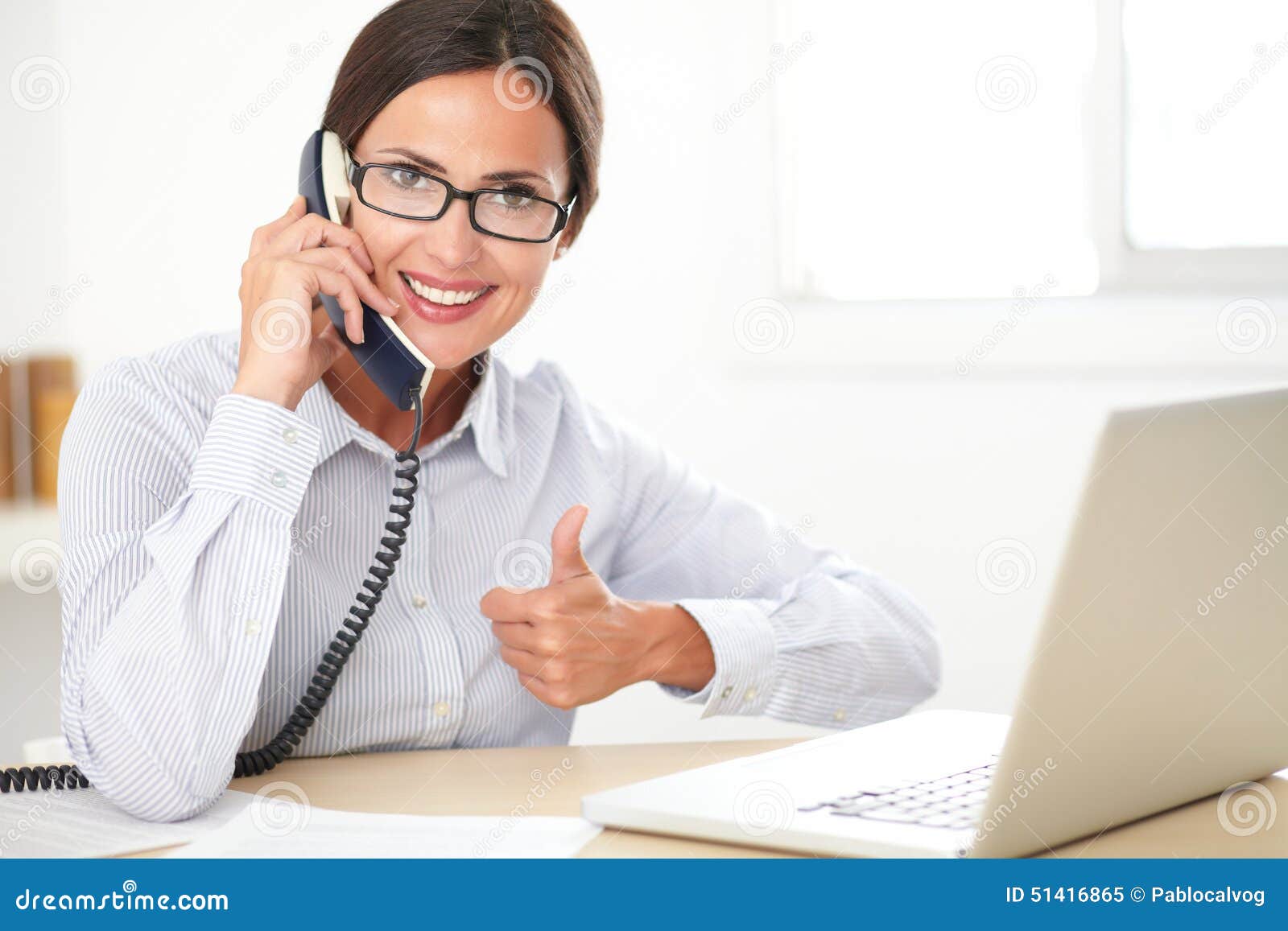 Latin Receptionist Talking on the Phone Stock Image - Image of ...