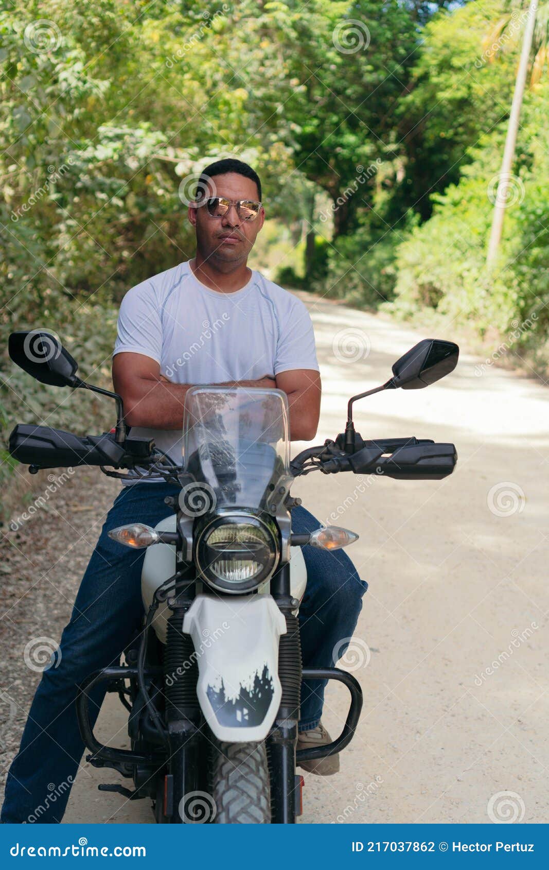 Latino Motorcyclist with an Open-air Racing Motorcycle Stock Photo ...