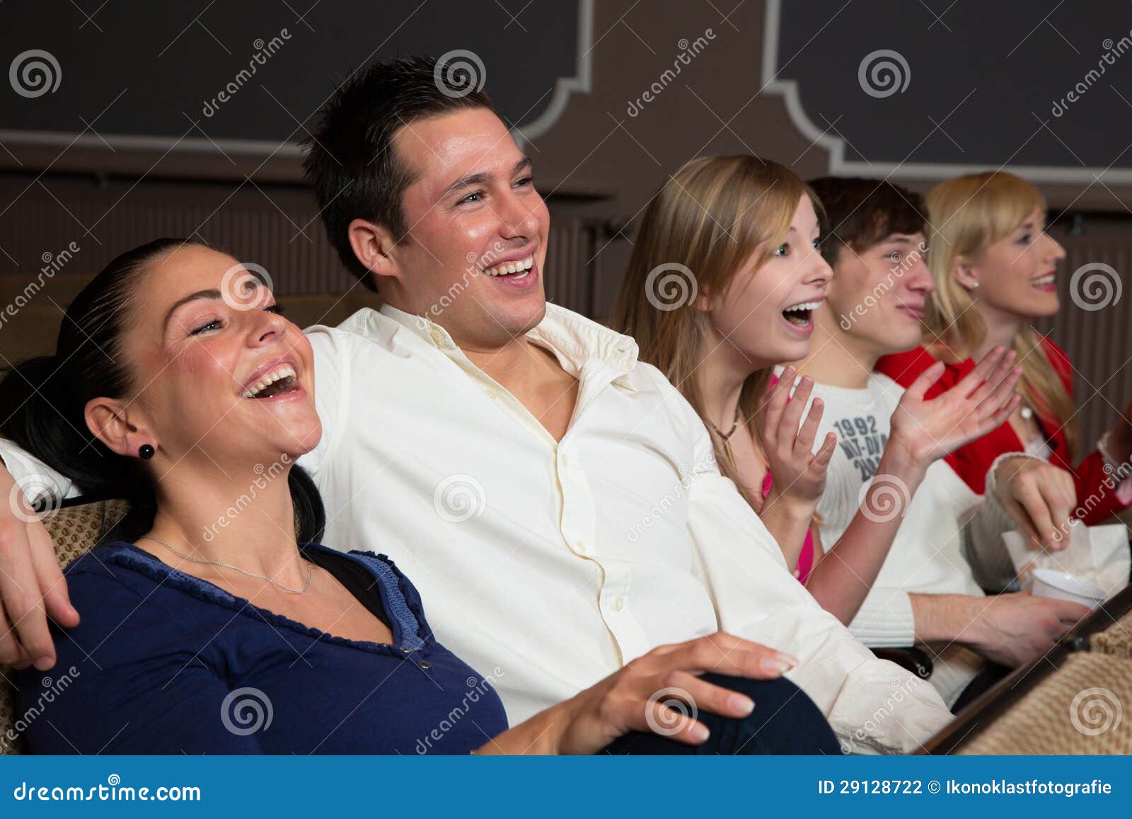 Laughing Audience at the Movies Stock Photo - Image of friends ...