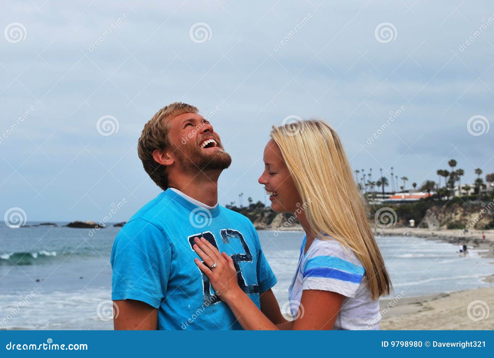 Laughing Beach Couple stock photo. Image of couple, handsome - 9798980