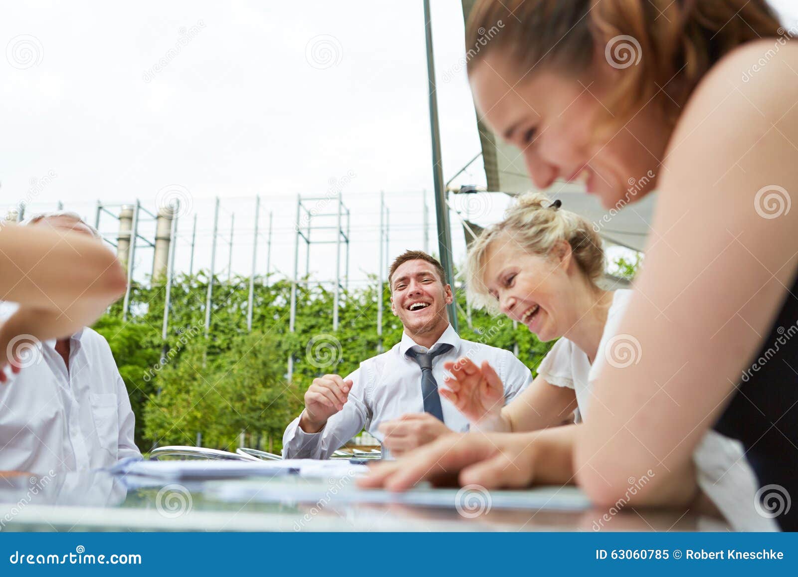Laughing Business People on a Table Stock Image - Image of ...