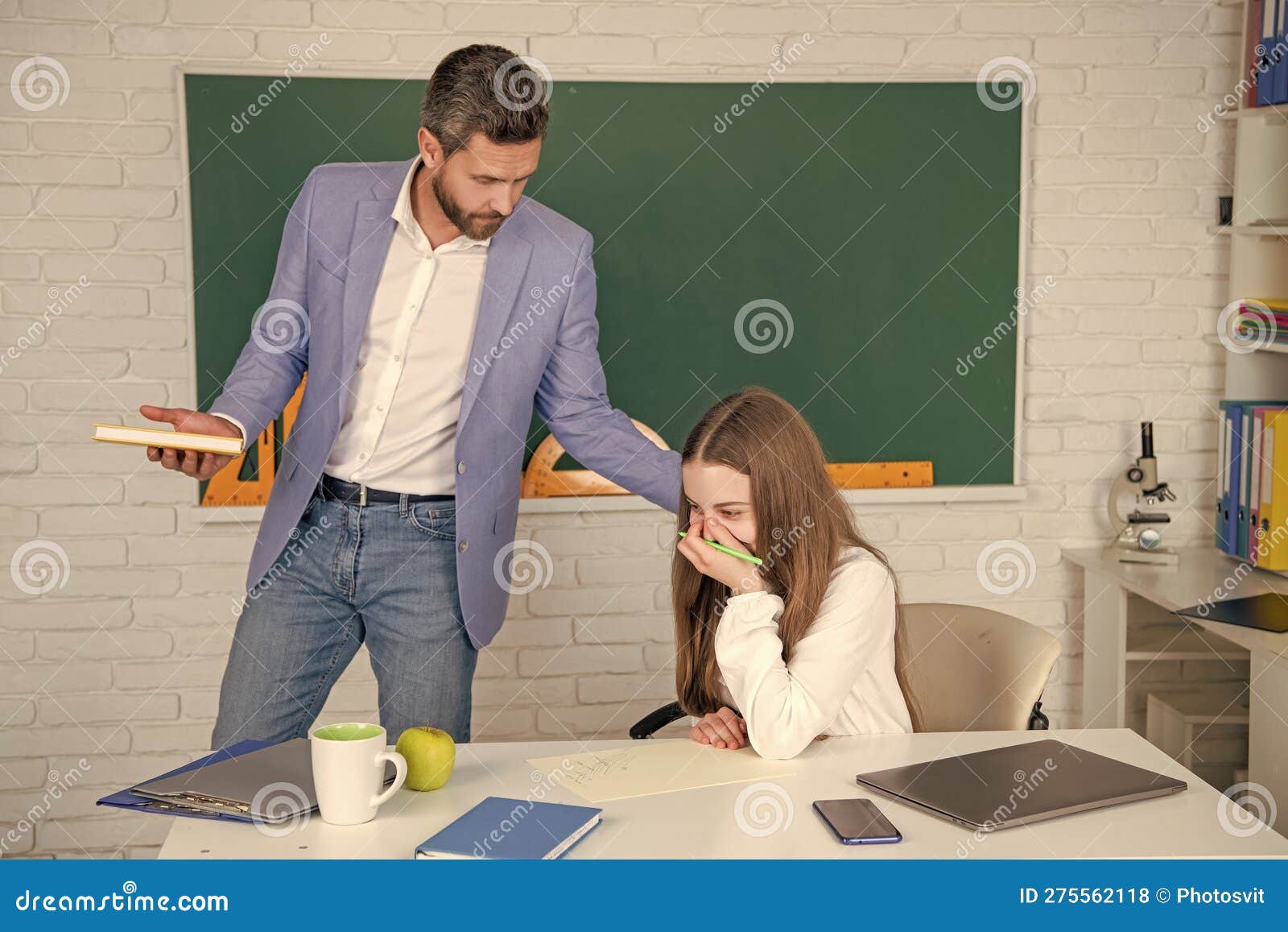 Laughing Child Study in Classroom with Confused Teacher Stock Photo ...