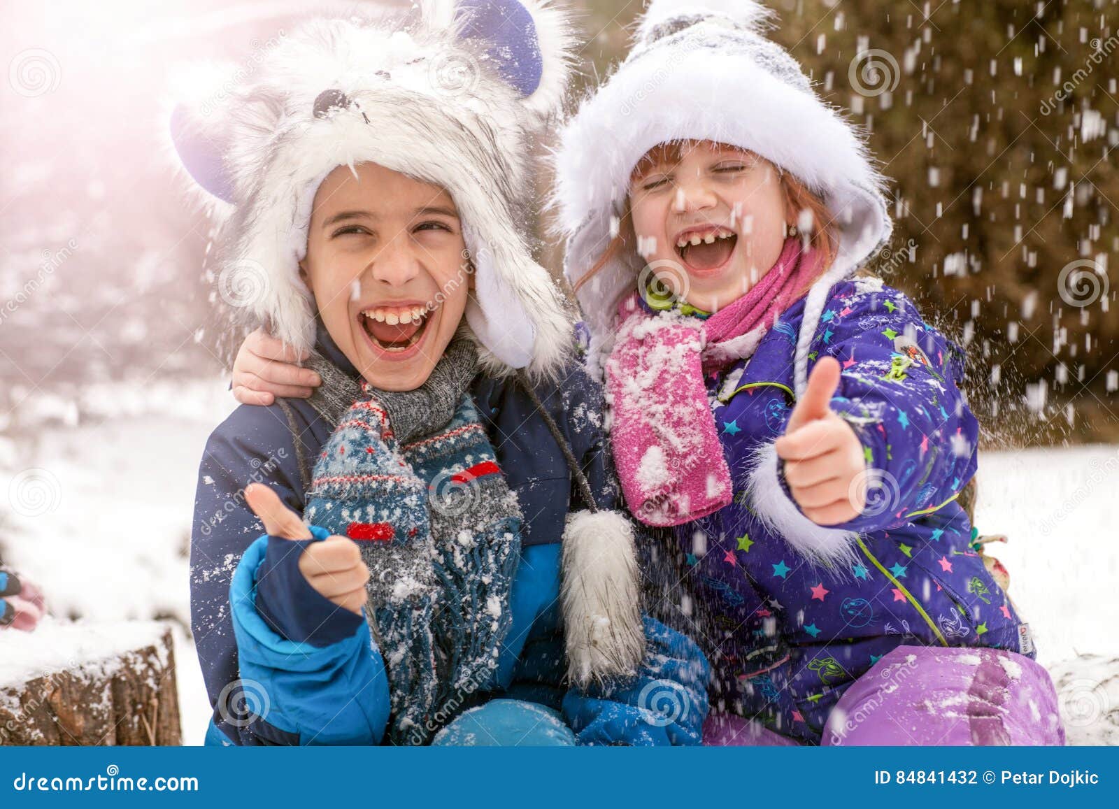 Laughing Children Playing in Snow Stock Photo - Image of coat ...
