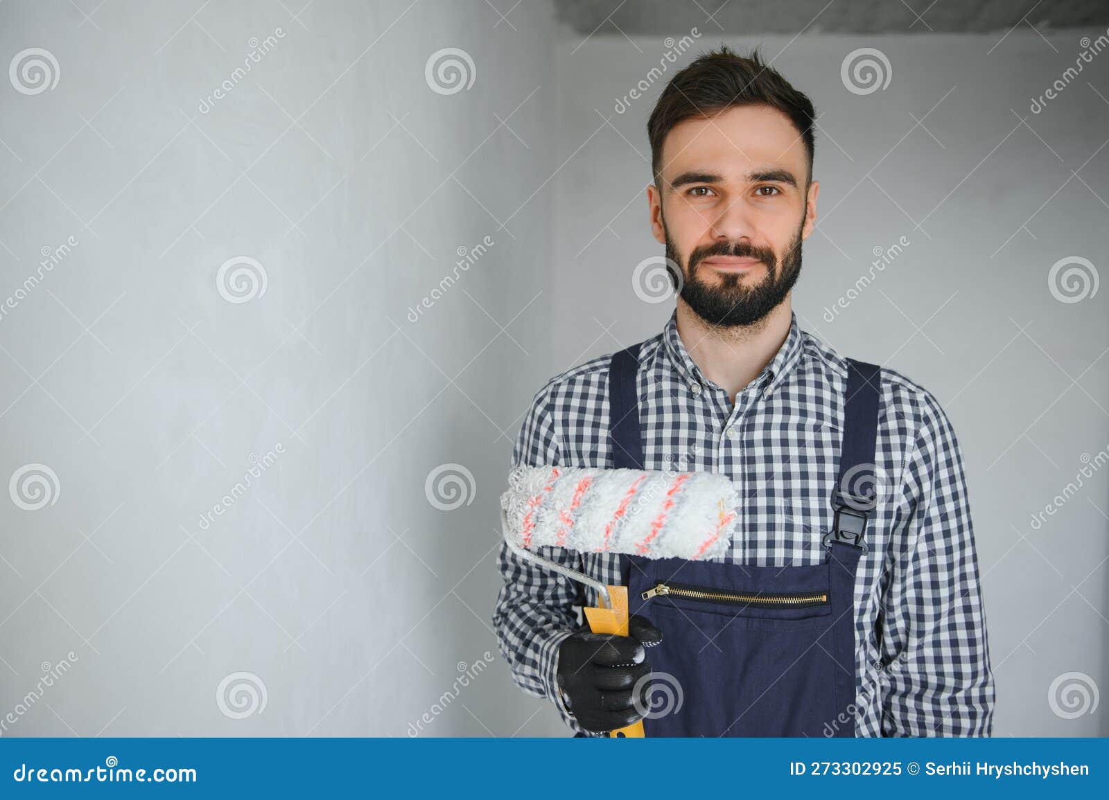 Laughing Construction Worker on the Background of a Gray Concrete Wall ...