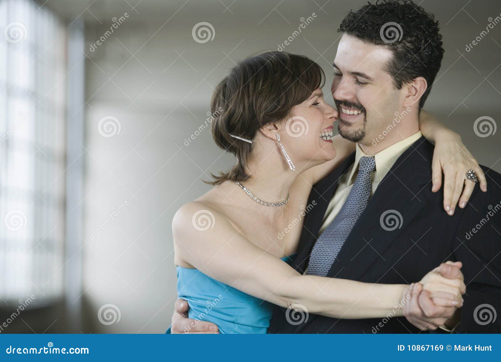 Laughing couple dancing stock image. Image of indoors - 10867169