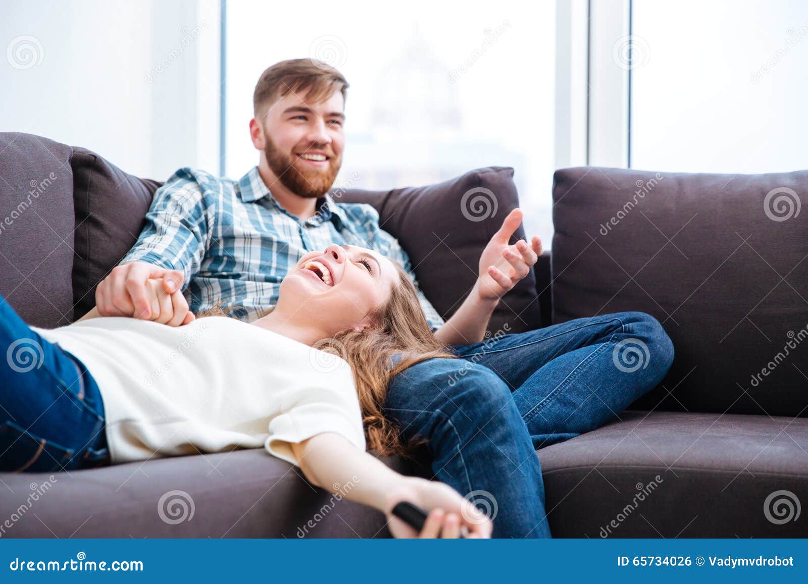 Laughing Couple Having Fun on the Sofa Stock Photo - Image of adult ...