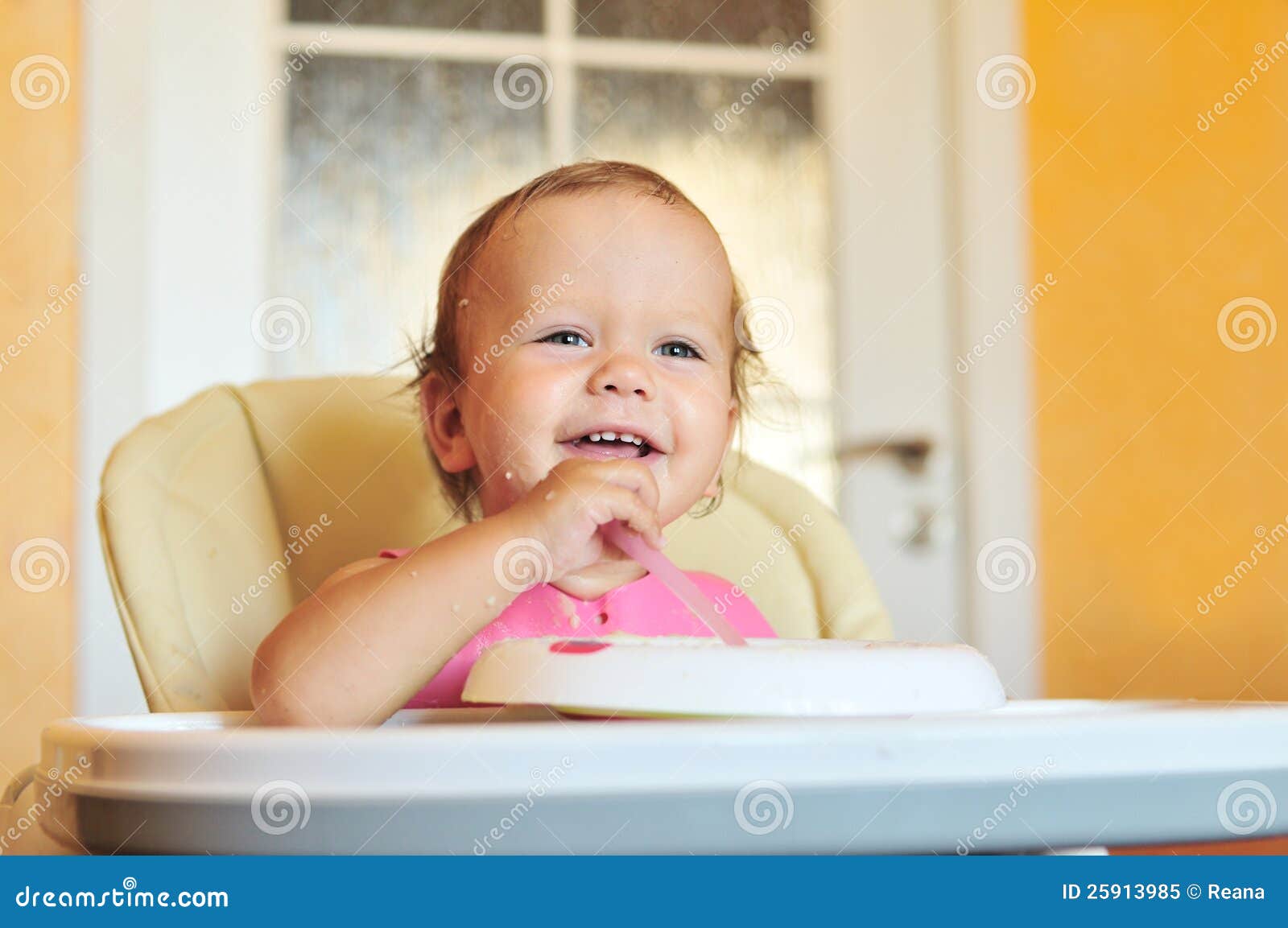 Laughing eating baby girl stock image. Image of female - 25913985