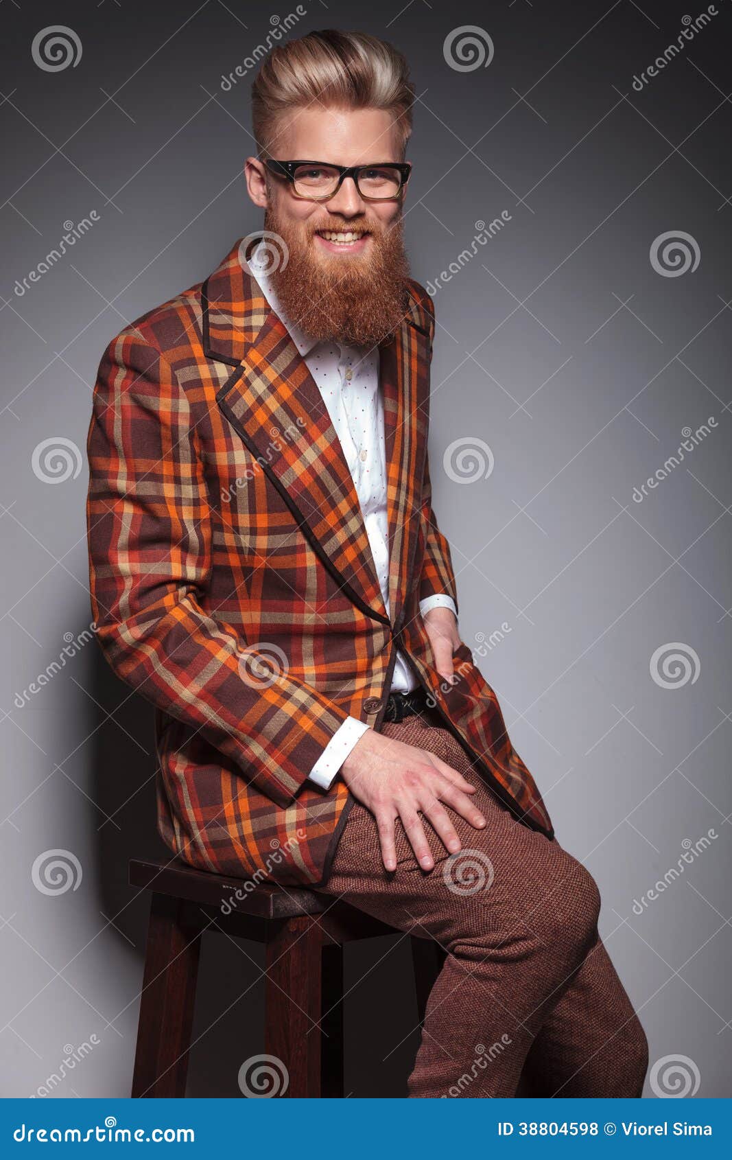 Man With Long Beard Enjoy Ice Cream While Sits On Grass Delicacy
