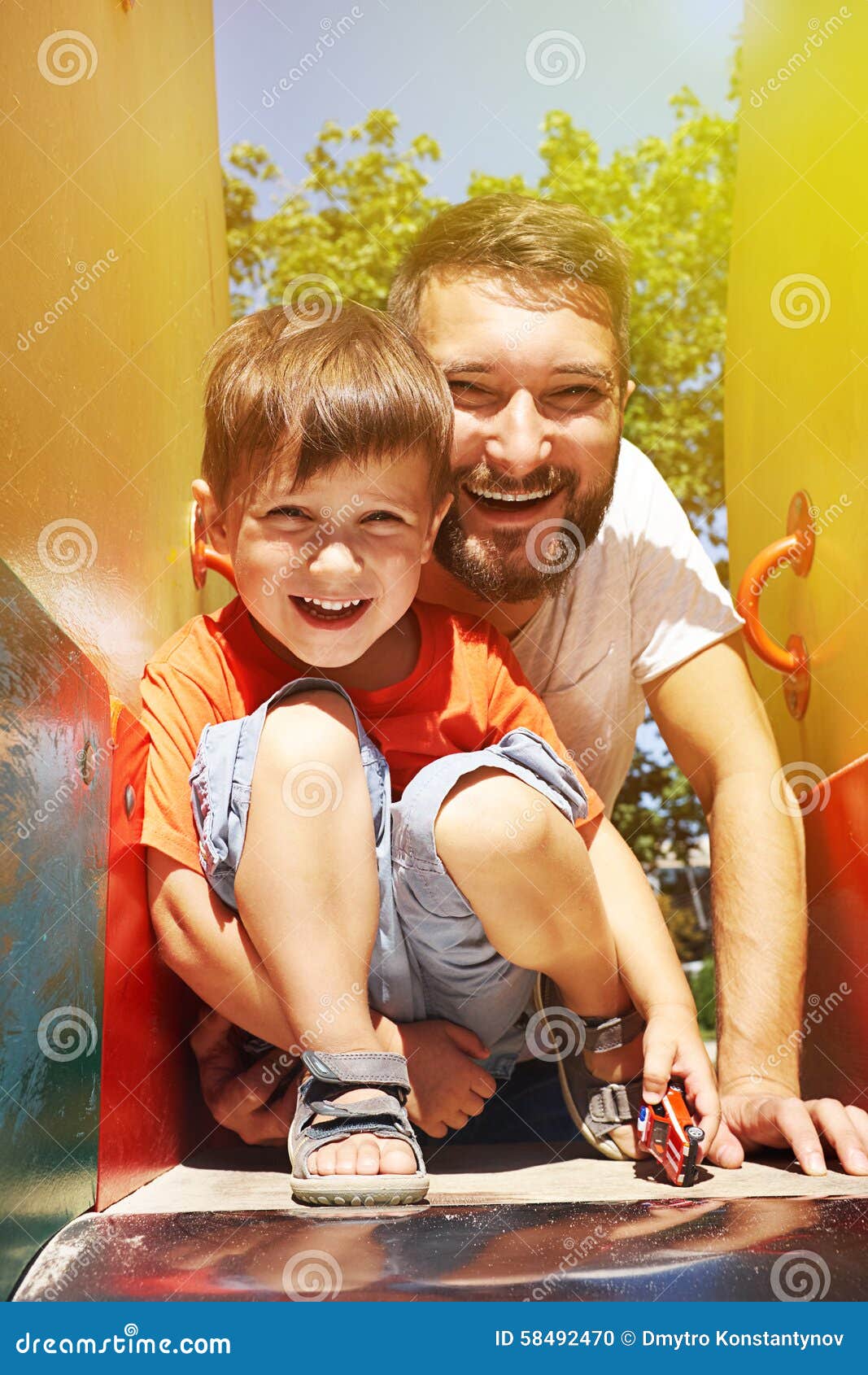 Laughing father with son stock photo. Image of leisure - 58492470
