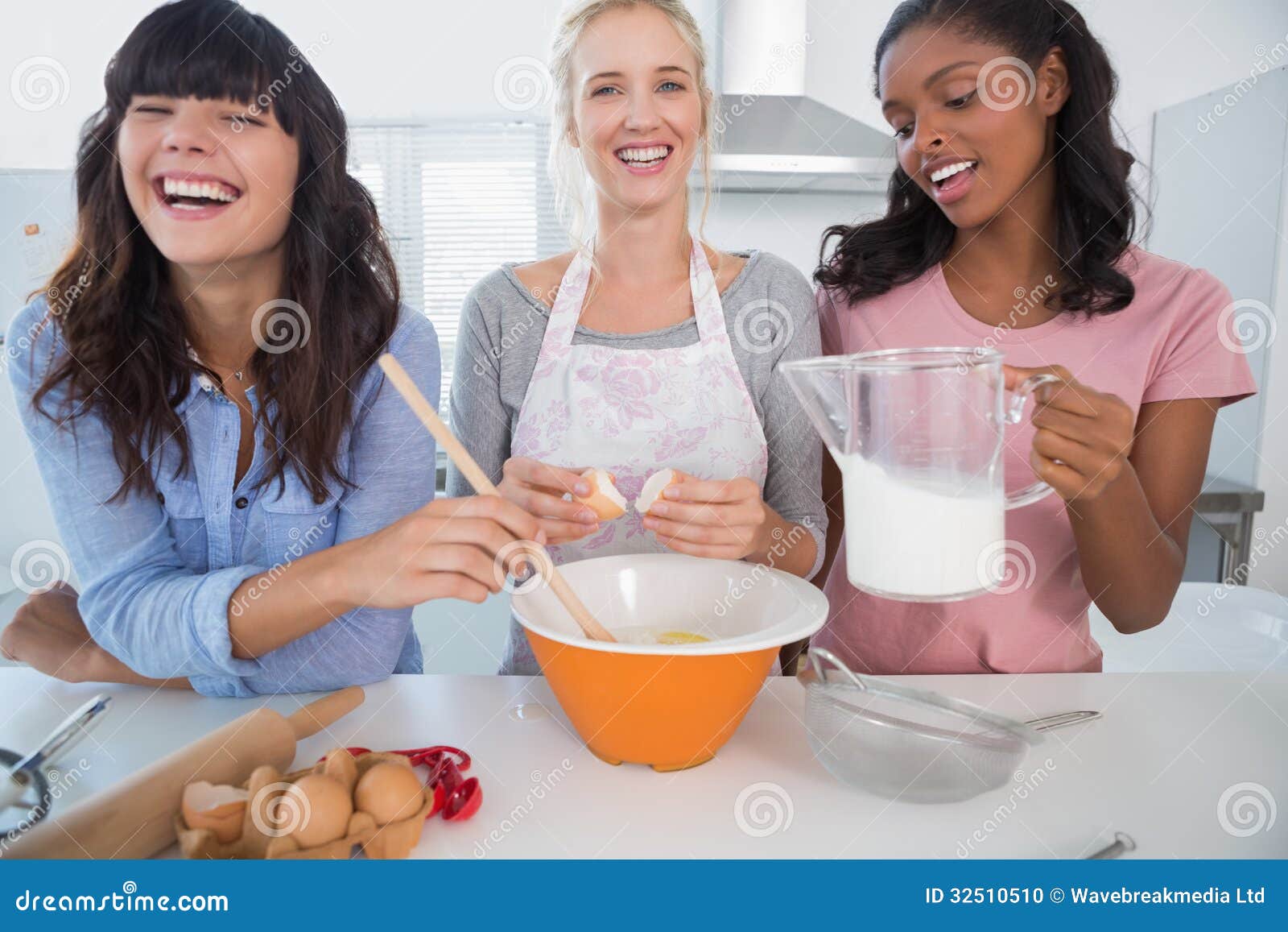 Laughing Friends Making Pastry Together Stock Photo - Image of cracking ...