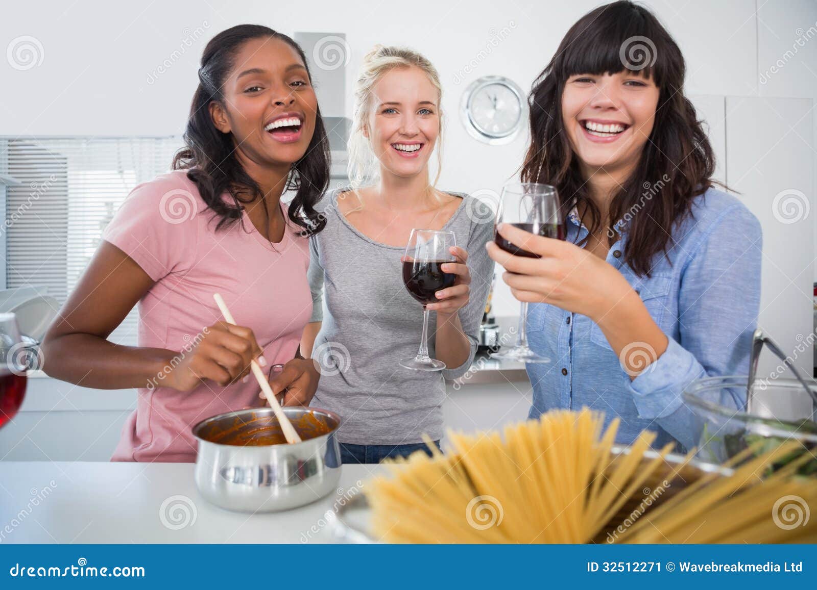 Laughing Friends Making Spaghetti Dinner Together and Drinking R Stock ...