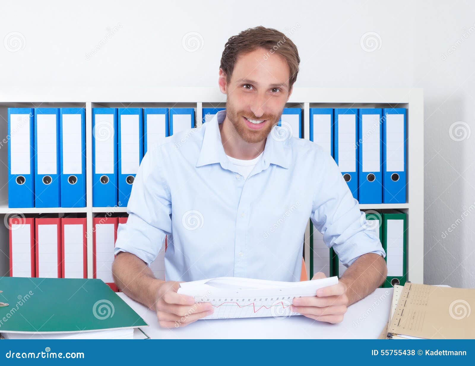 Laughing German Businessman with Contract at Office Stock Photo - Image ...
