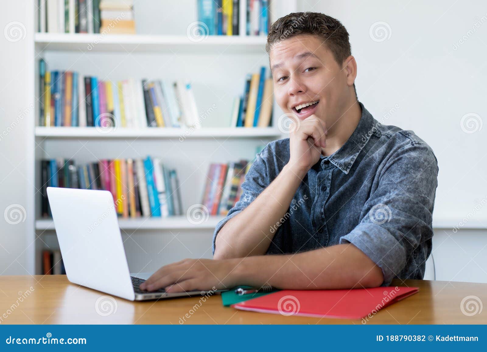 Laughing German Computer Science Student Working at Computer Stock ...
