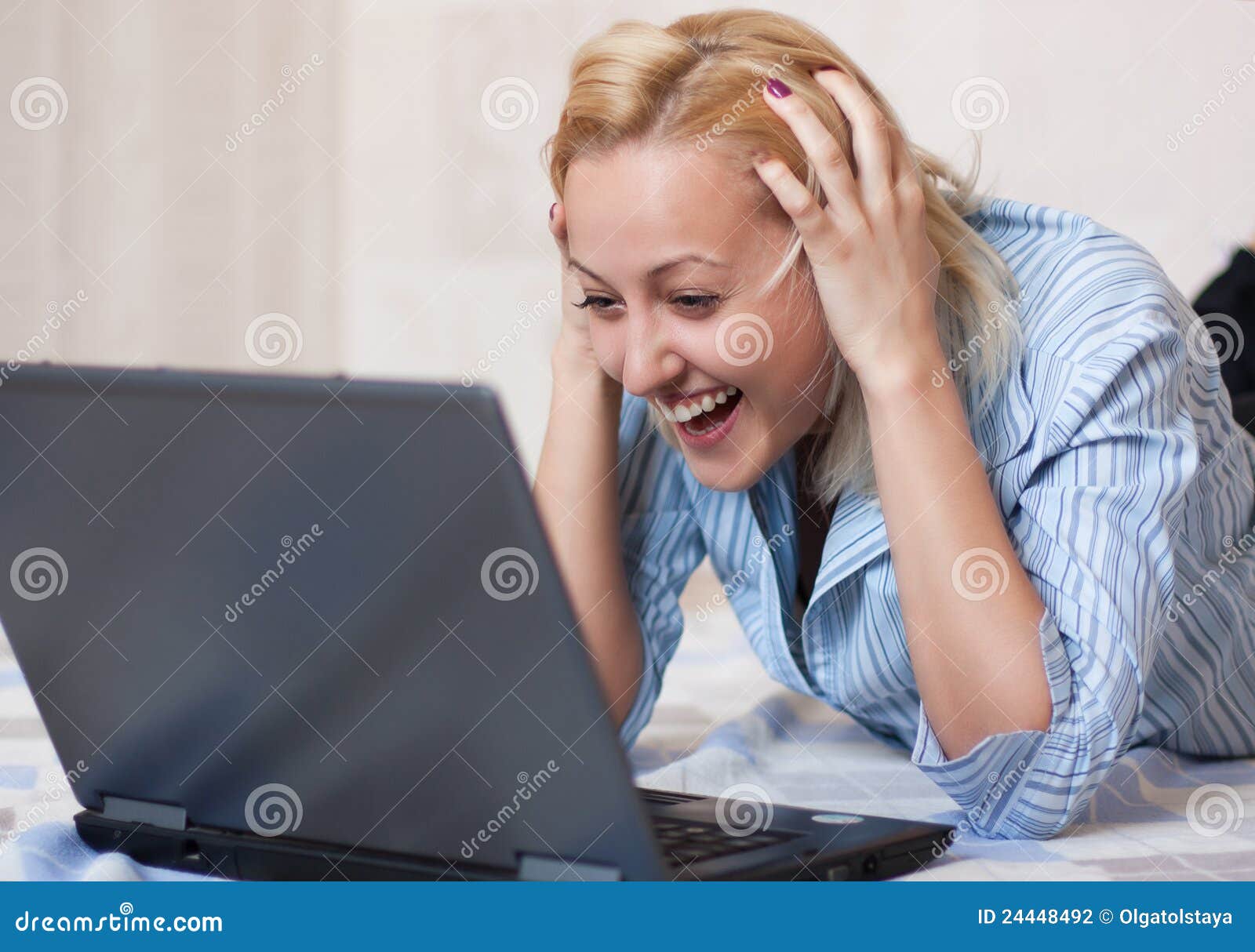 Laughing girl with laptop stock photo. Image of face - 24448492