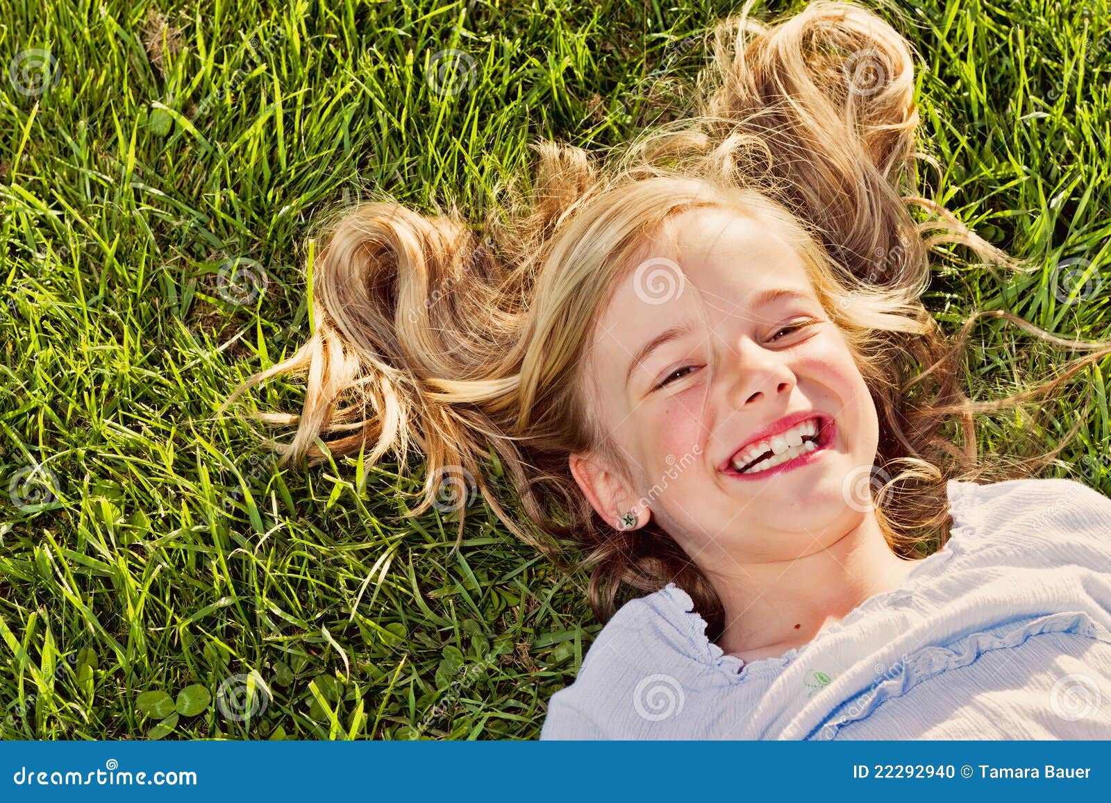 Laughing Girl Lying in Grass Stock Photo - Image of fresh, laugh: 22292940