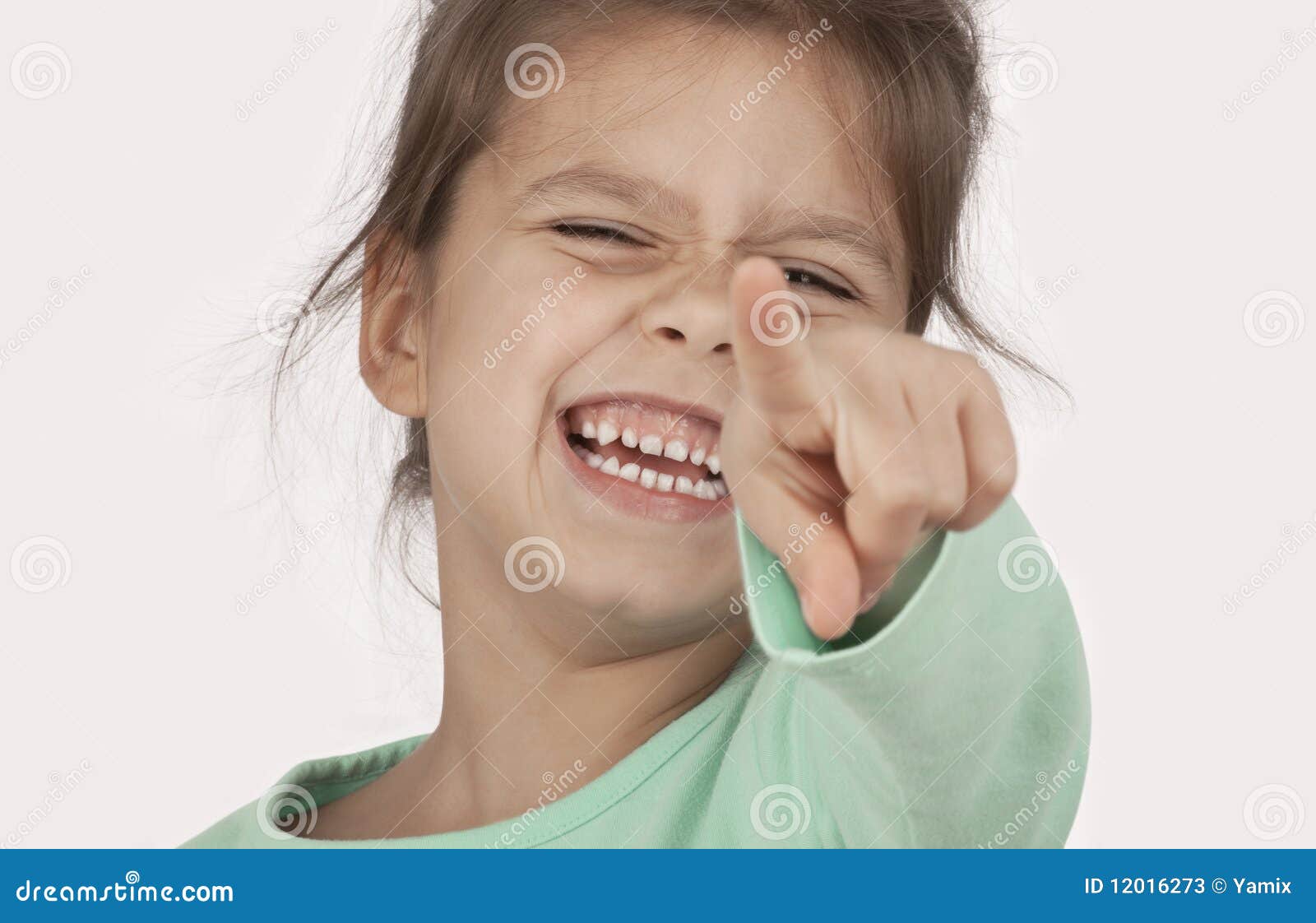 Laughing girl pointing stock image. Image of behavior - 12016273