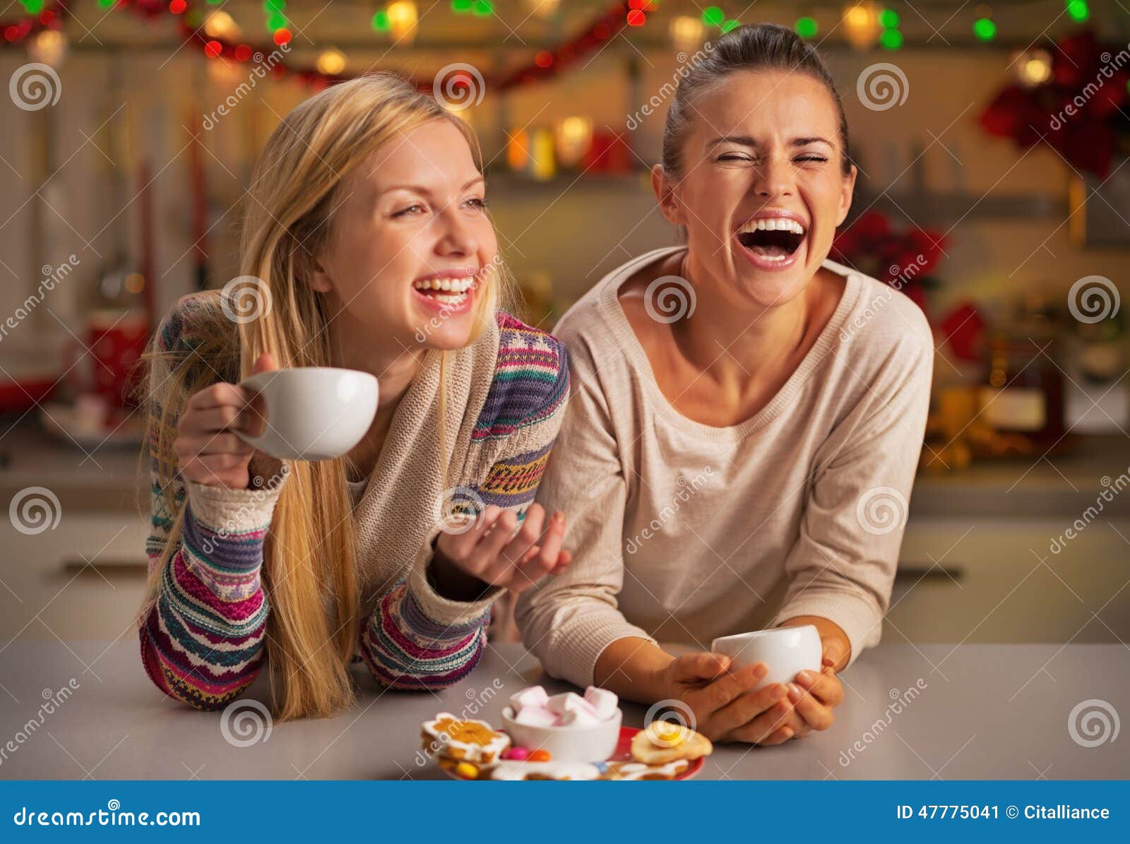 Laughing Girlfriends Having Christmas Snacks Stock Image - Image of ...