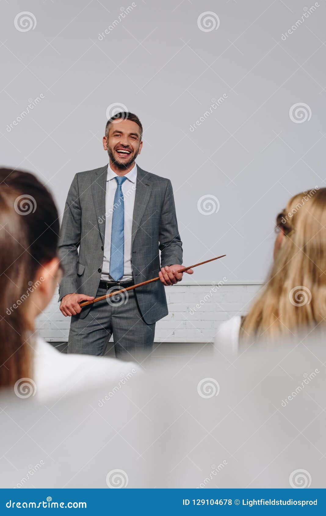 Laughing Handsome Business Coach Holding Pointer Stick during Training ...