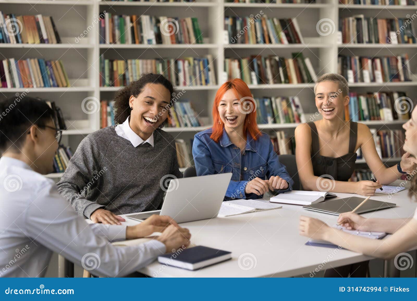 Laughing Interracial Group of Students Studying in Library Stock Photo ...