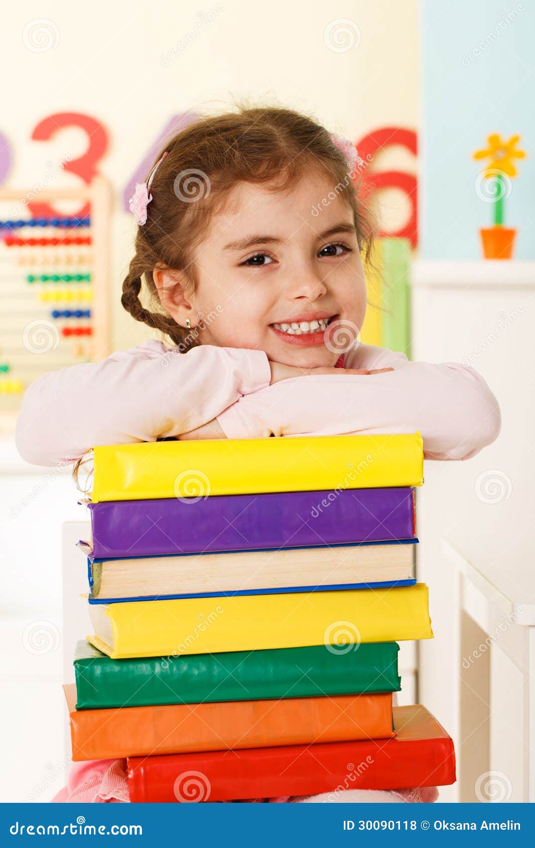 Little girl with books stock photo. Image of brunette - 30090118